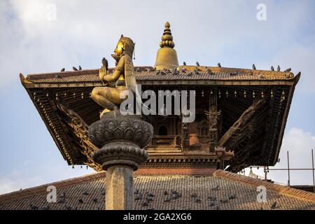 side view of Garuda statue in Natural rock garden in Tirumala, Tirumala ...
