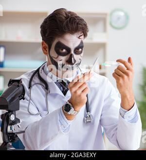 Scary monster doctor working in lab Stock Photo - Alamy