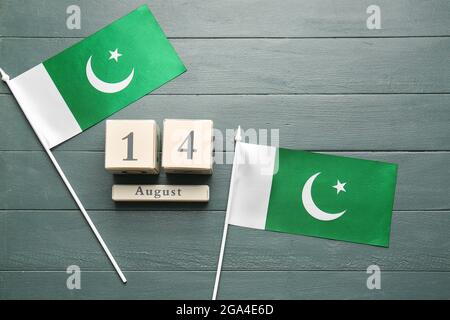 Flags of Pakistan and calendar with date of Independence Day on color ...