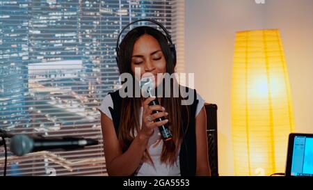 Beautiful girl singing In Recording Studio with microphone Stock Photo ...