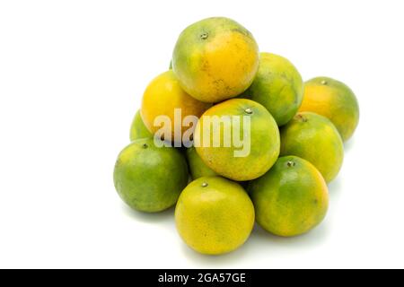 Closeup shot of piled citrus fruits on a wooden surface Stock Photo - Alamy