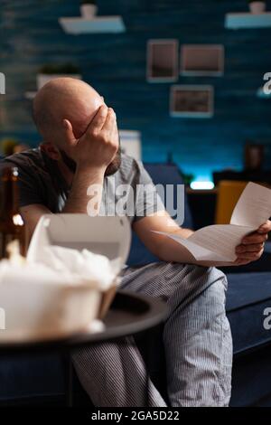 A man reading a letter and crying Stock Photo - Alamy
