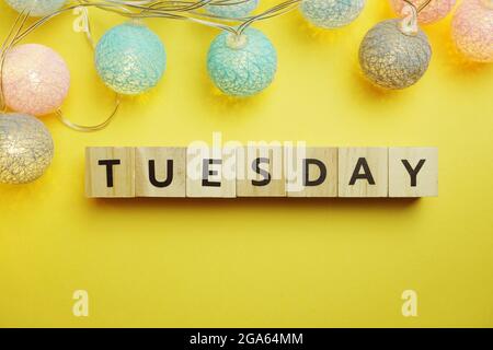Happy Tuesday alphabet letters with LED cotton balls decorate on wooden ...