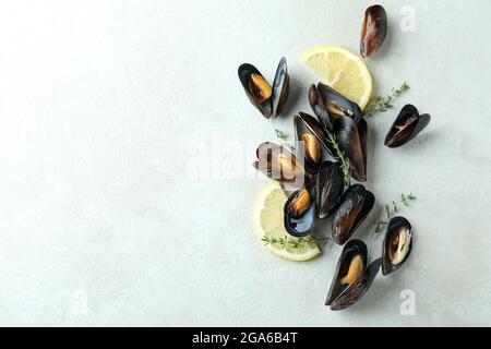 Fresh mussels on white textured background, top view Stock Photo - Alamy