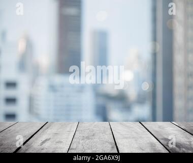 Panoramic empty grunge wood counter table top on blur glass window ...