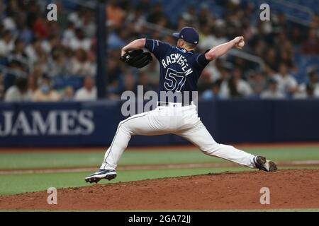 Tampa Bay Rays relief pitcher Mason Englert is looked at by a trainer ...
