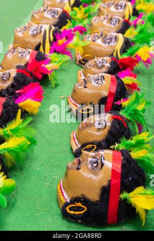 Santhal tribal masks of man and woman with bright colorful feathered ...