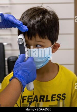 Boy getting eye exam at optometrist's office, USA Stock Photo - Alamy
