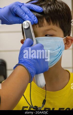 Boy getting eye exam at optometrist's office, USA Stock Photo - Alamy