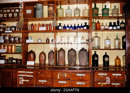 Vintage medical pharmaceutical colorful chemical bottles on the shelf ...