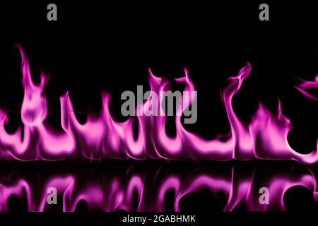 Pink fire flames on black background Stock Photo - Alamy