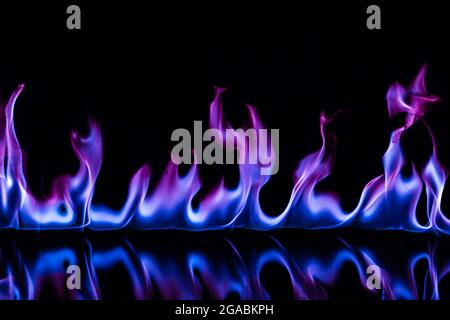Blue color fire flames on black background Stock Photo - Alamy