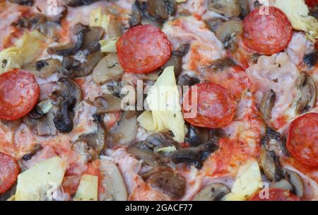 detail of pizza called capricciosa with mushrooms artichokes spicy ...