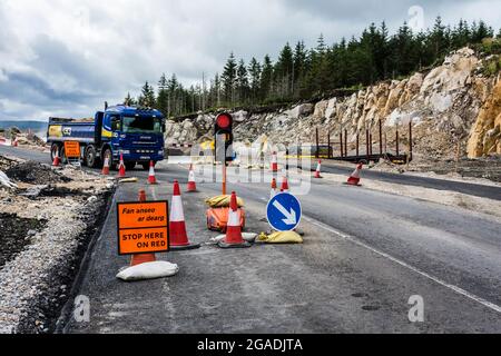 Roadworks traffic lights in Gaelic Irish and English language. N56 road ...