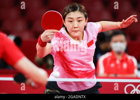 Mengu Yu plays a shot during the Women's Singles Table Tennis Semifinal match between Meng Chen ...