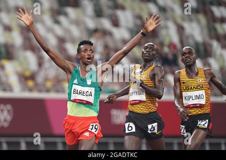 Selemon Barega, of Ethiopia, celebrates after winning the men's 10,000 ...