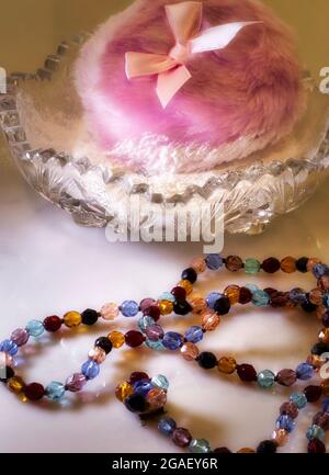 Close up of woman's vanity including talcum powder with puff in a cut ...