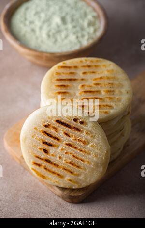 Arepa is a type of meal made from ground corn dough, cornmeal, isolated ...