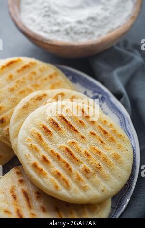 Arepa is a type of meal made from ground corn dough, cornmeal, isolated ...