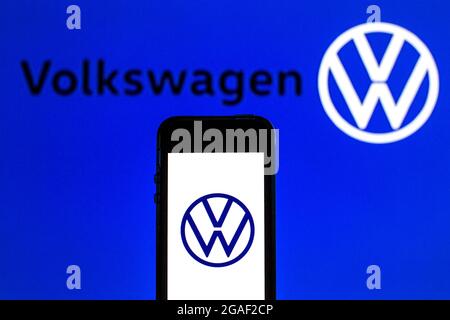 In this photo illustration, the Volkswagen logo is seen displayed on a ...