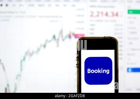 In this photo illustration, a Booking Holdings Inc logo seen displayed ...