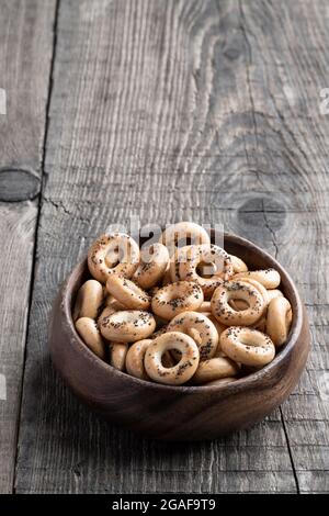 Bowl full of small traditional russian bread rings on wooden table ...