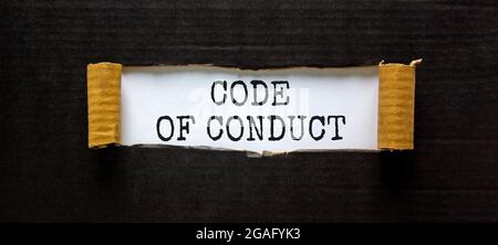 Code of conduct symbol. Words 'Code of conduct' appearing behind torn ...