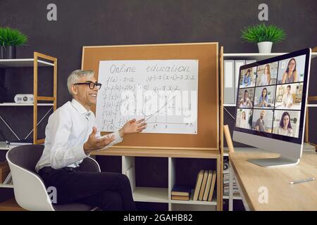 math teacher having online class at home Stock Photo - Alamy