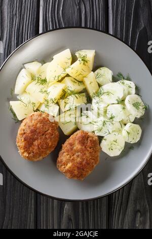 Polish pork meatballs Kotlety mielone with a side dish of boiled ...