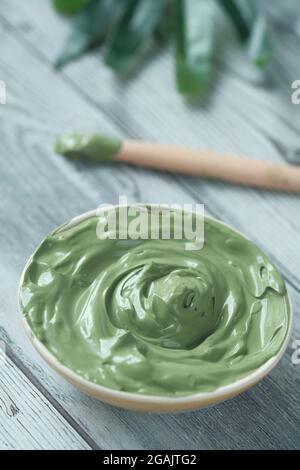 bubble clay mask in container on black background Stock Photo - Alamy