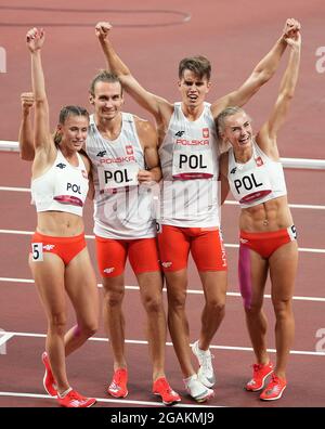 Members of Poland celebrate after winning Athletics women's 4x400m ...