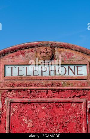 An original red telephone / coin operated phone / payphone / call box ...