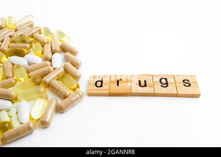 inscription DRUGS in wooden cubes on a white background of different ...