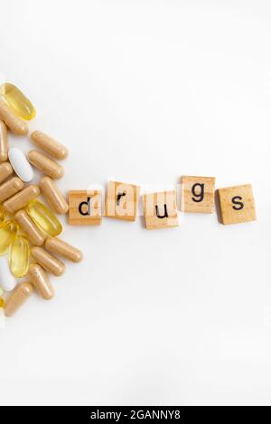 inscription DRUGS in wooden cubes on a white background of different ...