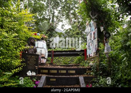 Bust of Marc Bolan at the site of his 1977 death in a car crash, with ...