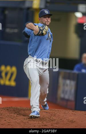 Tampa Bay Rays pitcher Jeffrey Springs winds up to throw from the mound ...