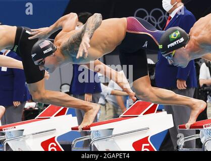 U.S. swimmer Caeleb Dressel dives off the starting block in the men's ...