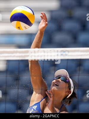 Wang Fan, and Xia Xinyi, of China, celebrate a point against Canada ...