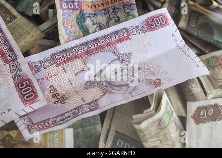 Heap of old Myanmar money. Stacks of Burmese banknotes. Burma currency ...