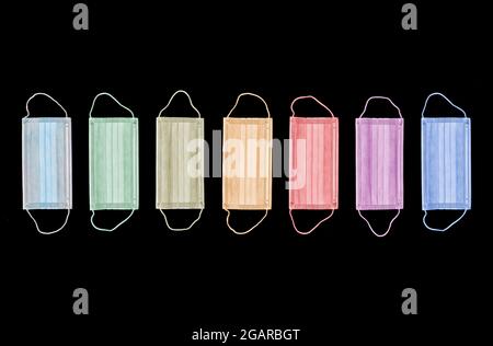 Disposable medical masks on black background copy space Stock Photo - Alamy