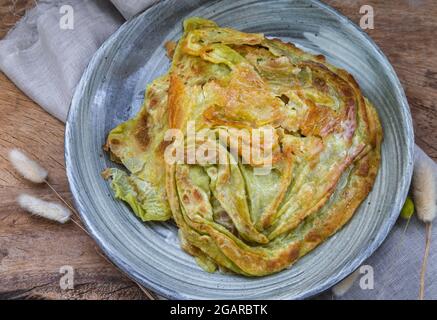 Homemade sweet frying roti (Thai Pancake) on ceramic plate. Delicious ...