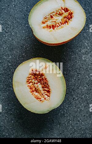 Ogen Melon, Halved on Plain Background with Copyspace, Room for Text ...
