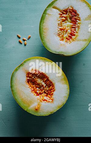 Ogen Melon, Halved on Plain Background with Copyspace, Room for Text ...