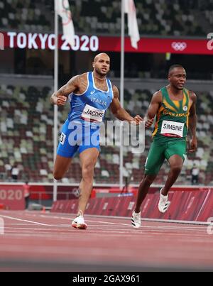 JACOBS Lamont Marcell of Italy (L) competes during Athletics men's 100m ...