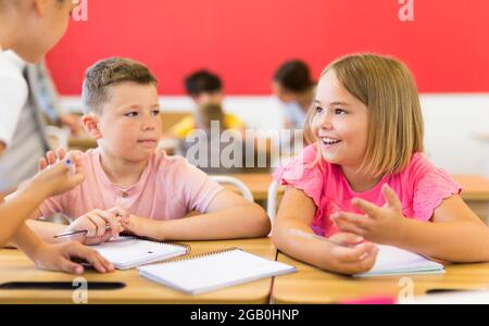 Children performing group tasks Stock Photo - Alamy