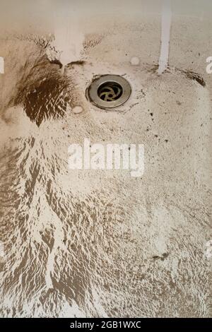Bath, base, bottom with pattern of dirt, detritus, sand, grit leaving ...