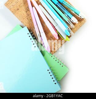 A pile of notebooks and stationary, isolated on white background Stock ...