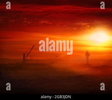 Beautiful sunset landscape with clouds and waves crashing on rocks ...