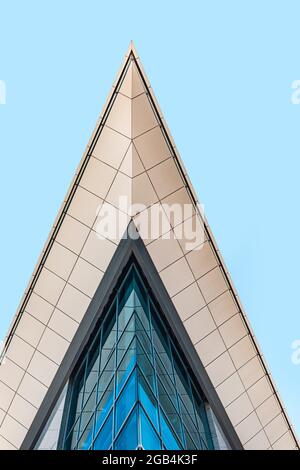 Work against low angle view of city buildings on sunny day Stock Photo ...