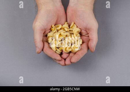 Nodi marini, insalatonde pasta. A portion of pasta on a white ethnic ...